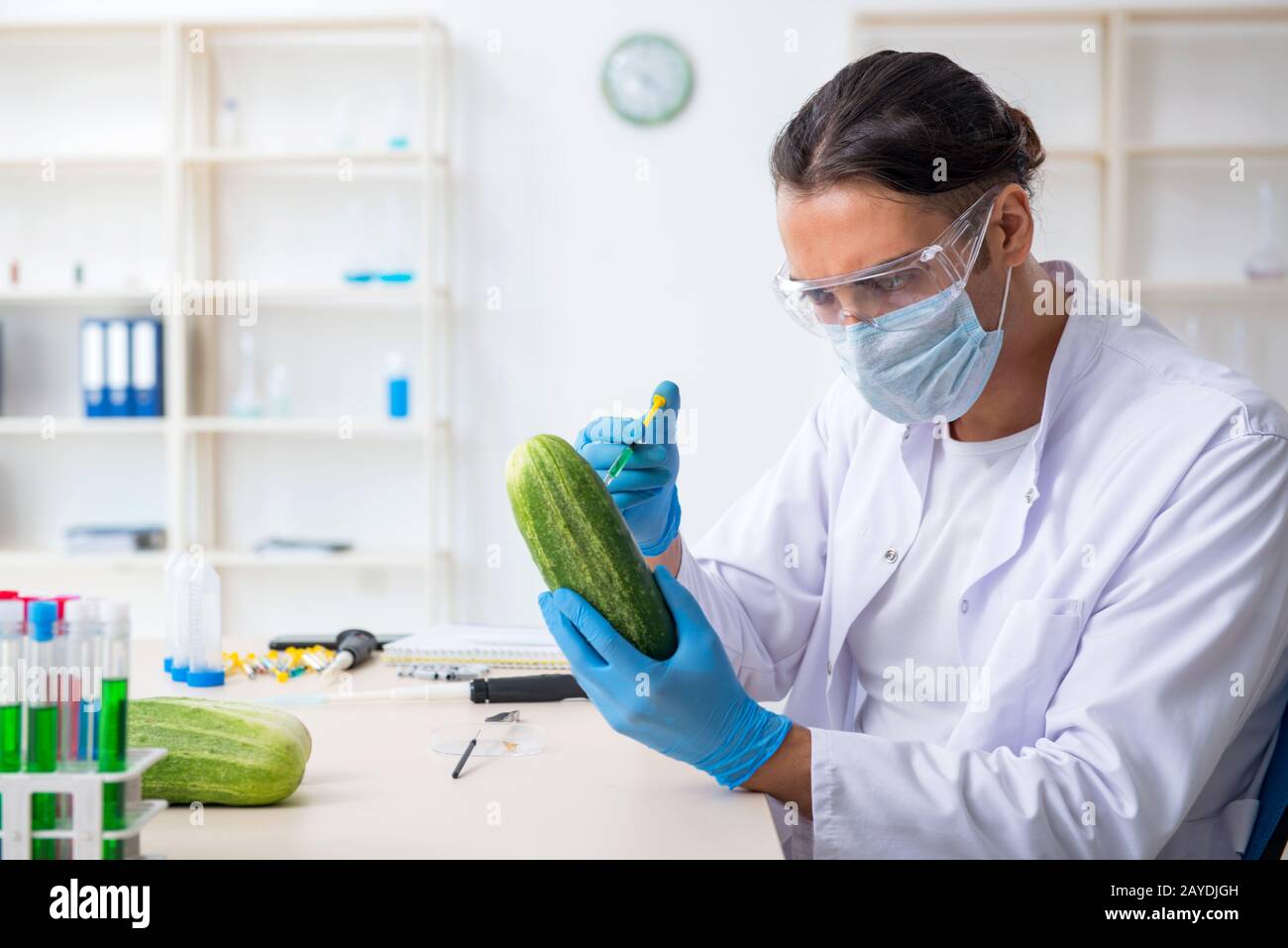 Male nutrition expert testing vegetables in lab Stock Photo - Alamy