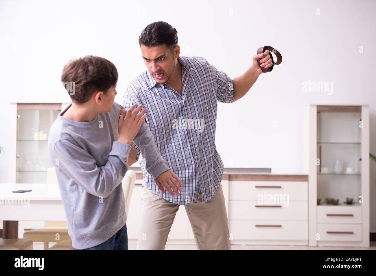 Father beating and punishing his sone Stock Photo - Alamy