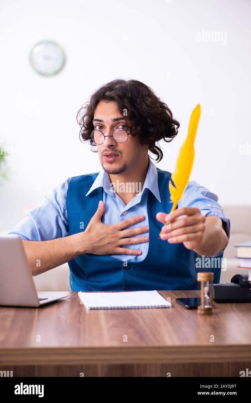Young writer working on his new work Stock Photo - Alamy