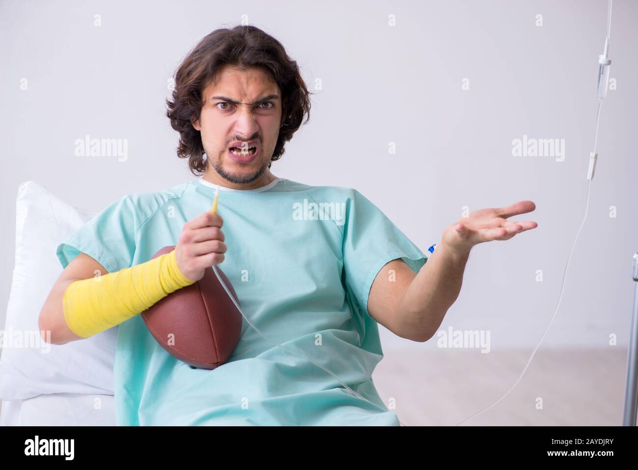 Young man staying in hospital in transfusion concept Stock Photo - Alamy