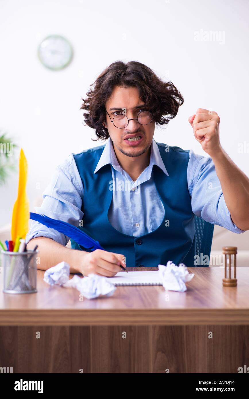 Young writer working on his new work Stock Photo - Alamy