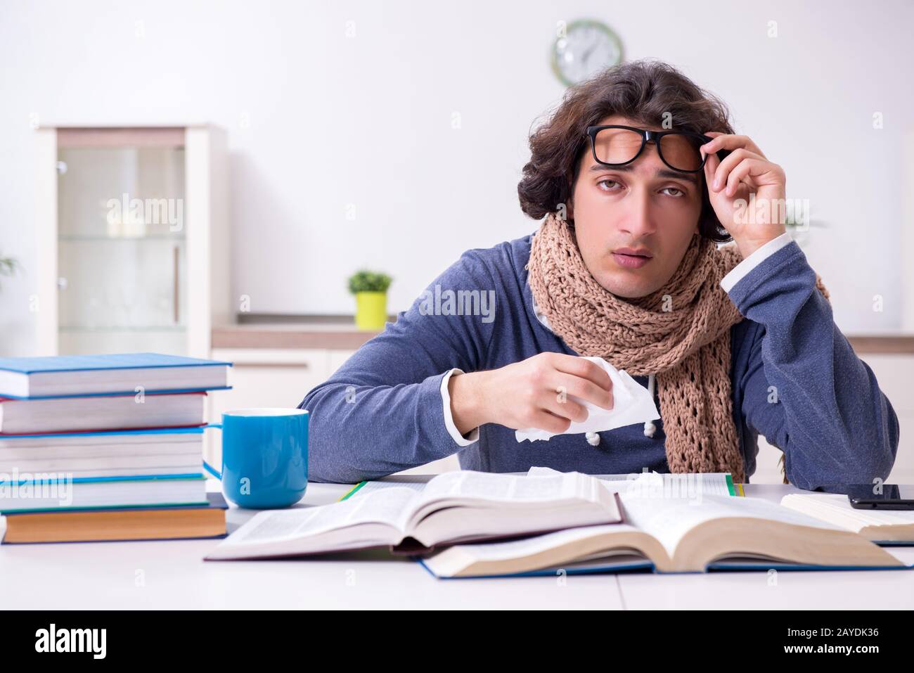 Sick male student suffering at home Stock Photo - Alamy