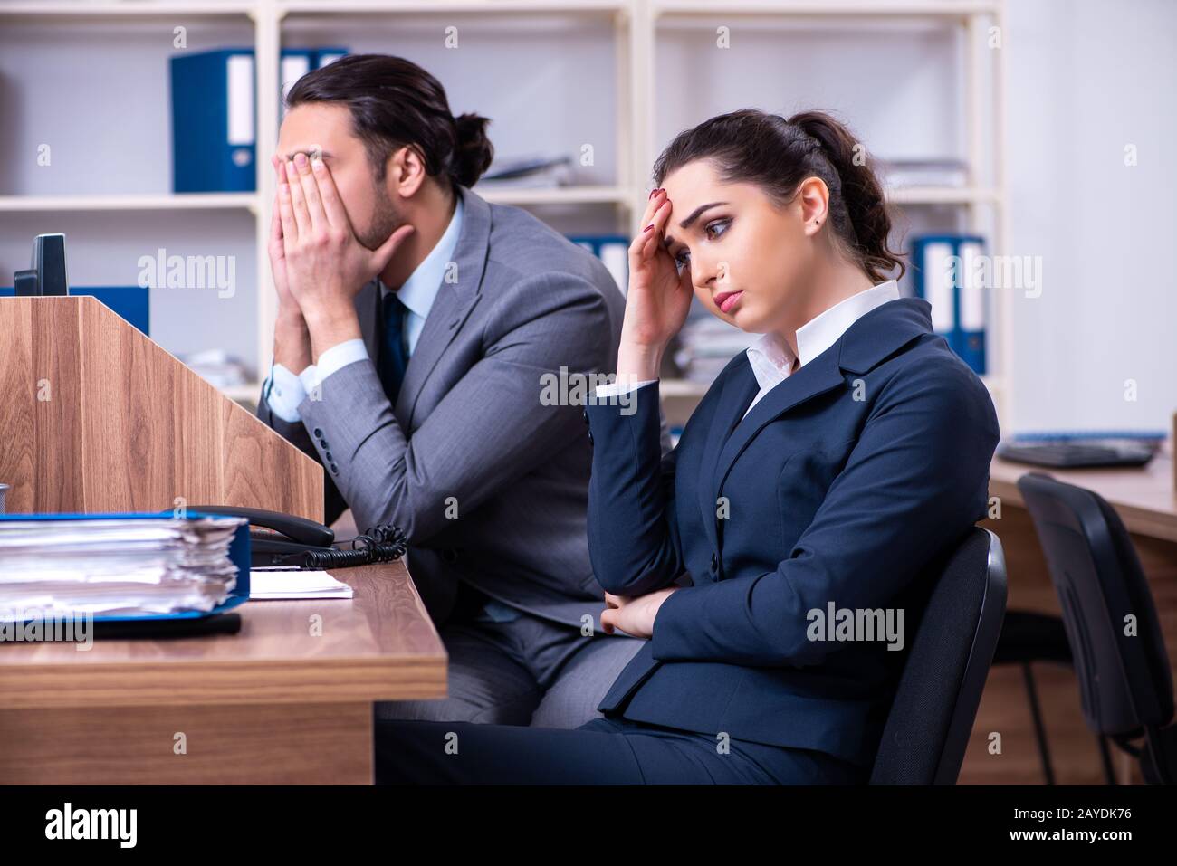 Two employees working in the office Stock Photo - Alamy
