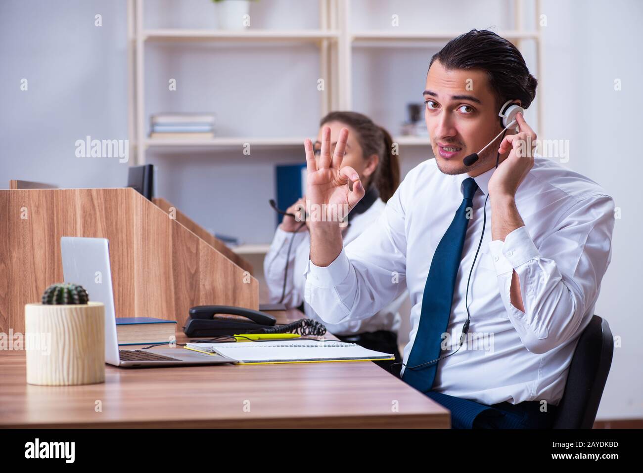 Call center operators working in the office Stock Photo - Alamy