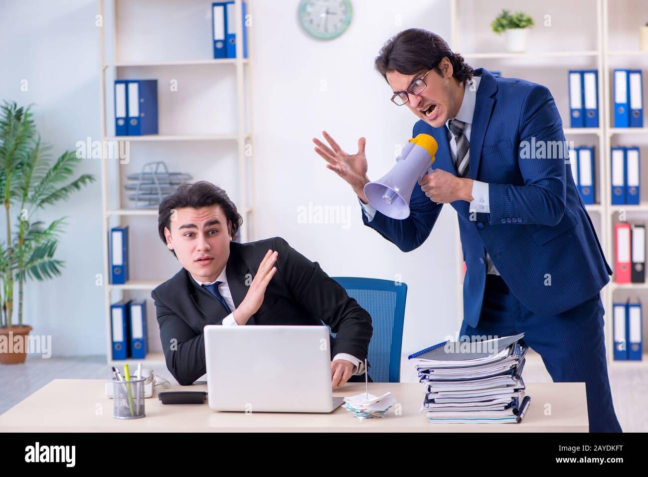 Angry boss yelling at his assistant secretary hi-res stock photography ...