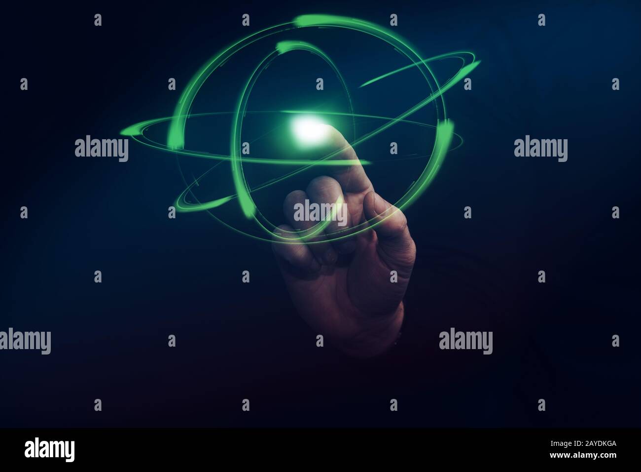 Human forefinger touches green atom. Mixed media Stock Photo - Alamy