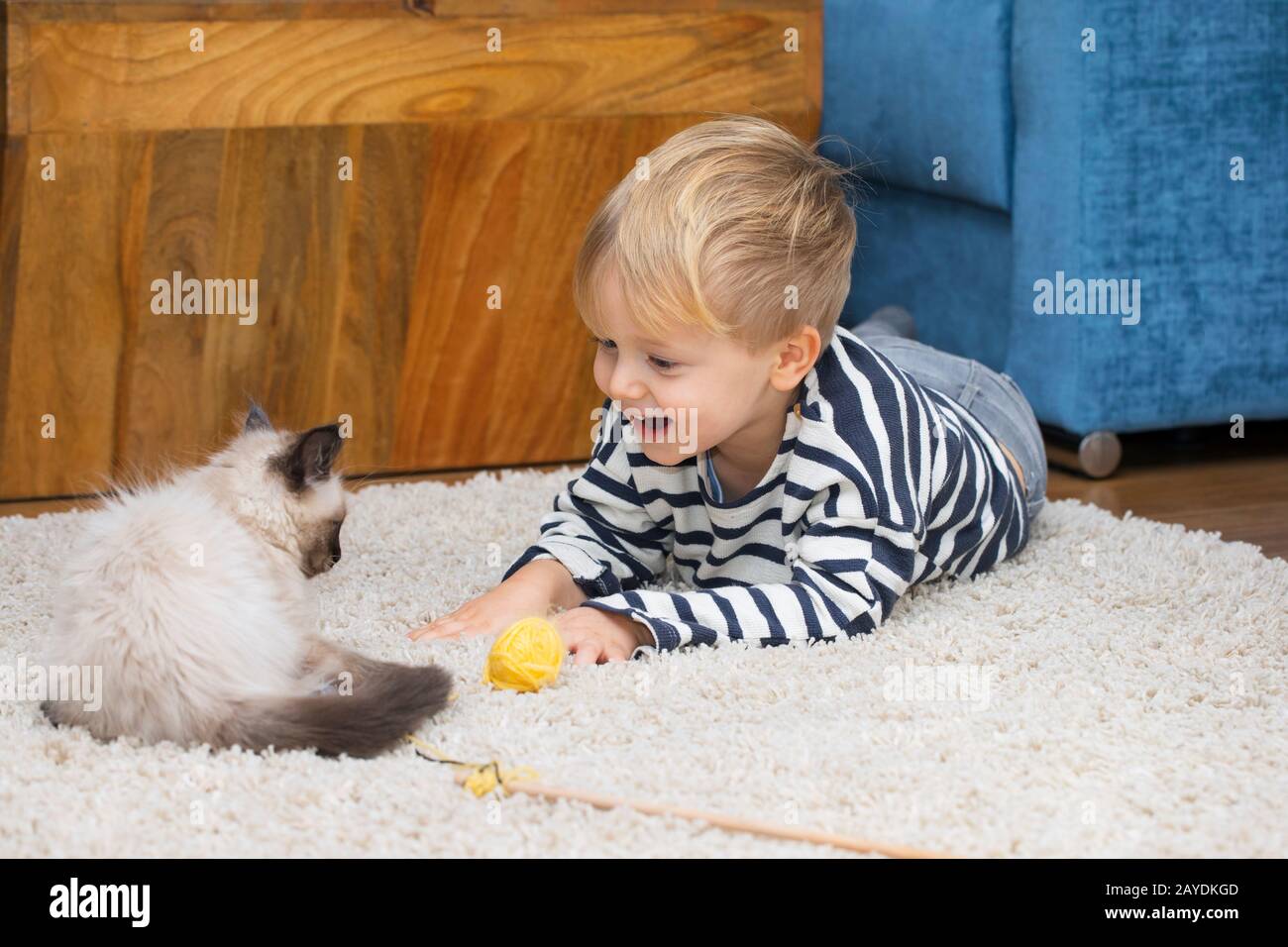 Boy cuddle floor hi-res stock photography and images - Alamy