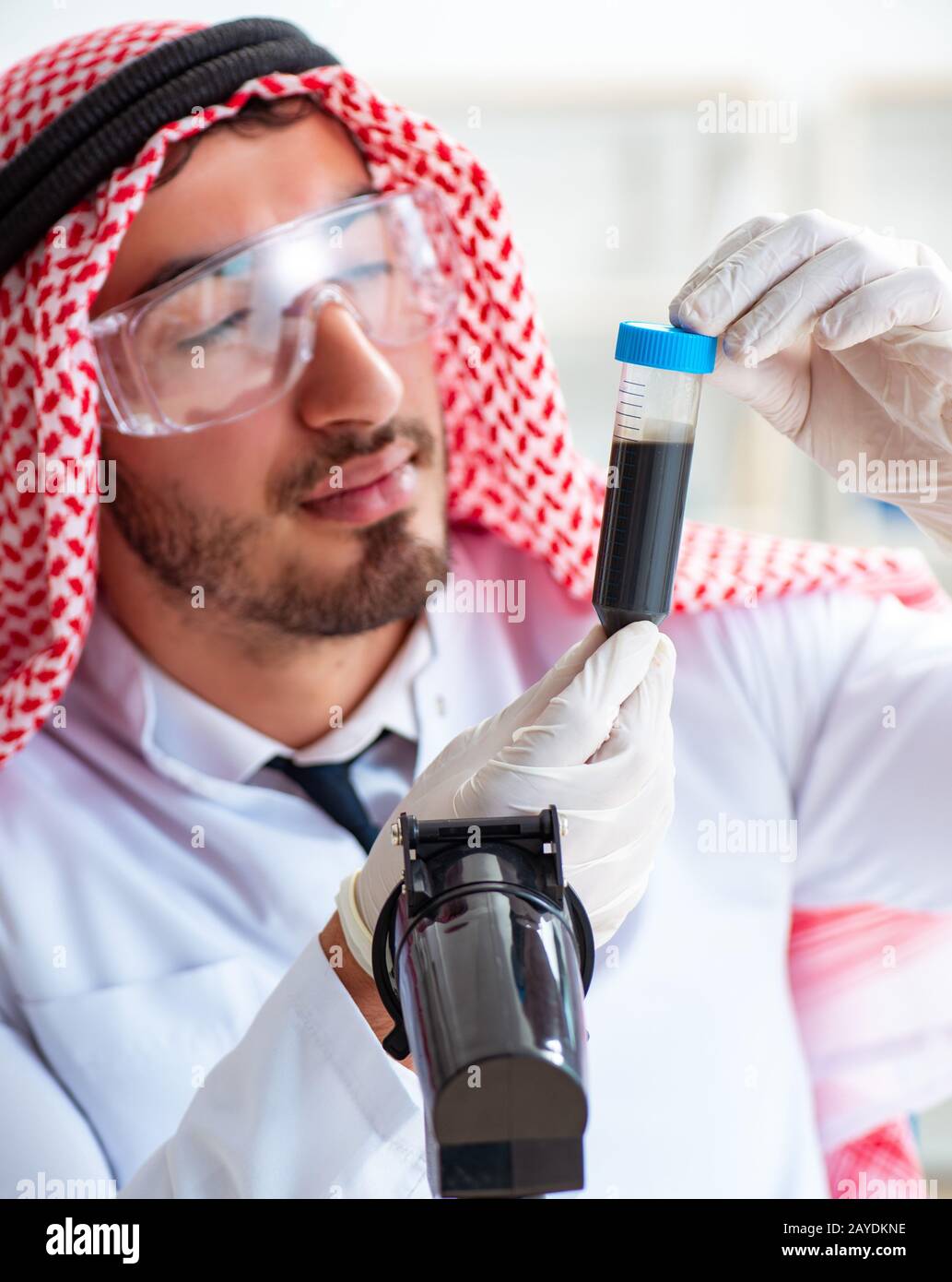 Arab chemist working in the lab office Stock Photo - Alamy