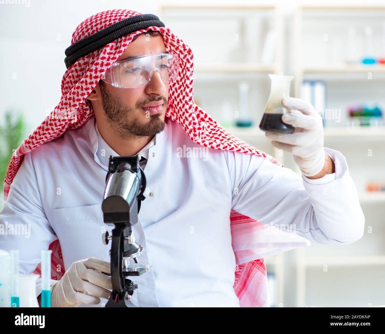 Arab chemist working in the lab office Stock Photo - Alamy