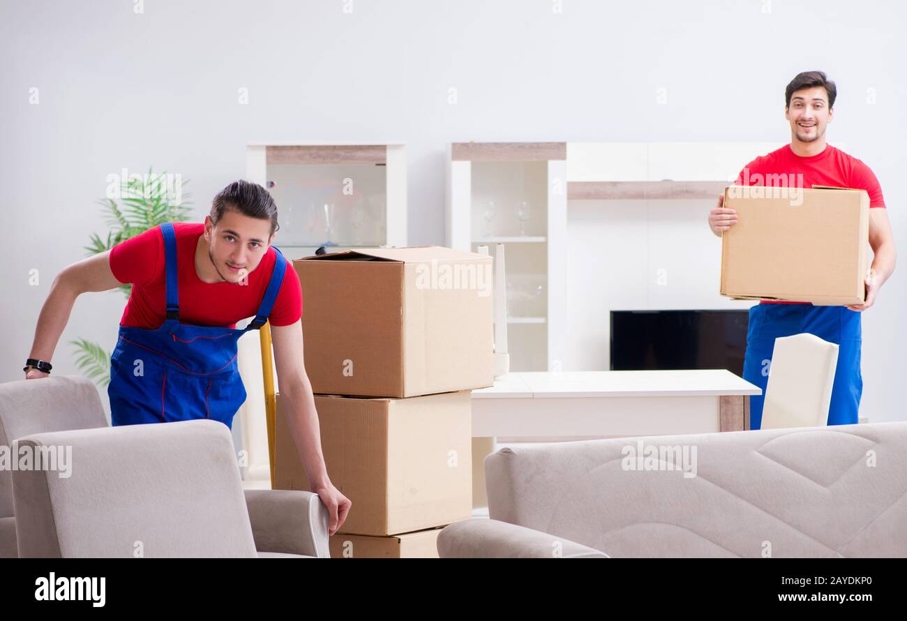 Two contractor employees moving personal belongings Stock Photo - Alamy