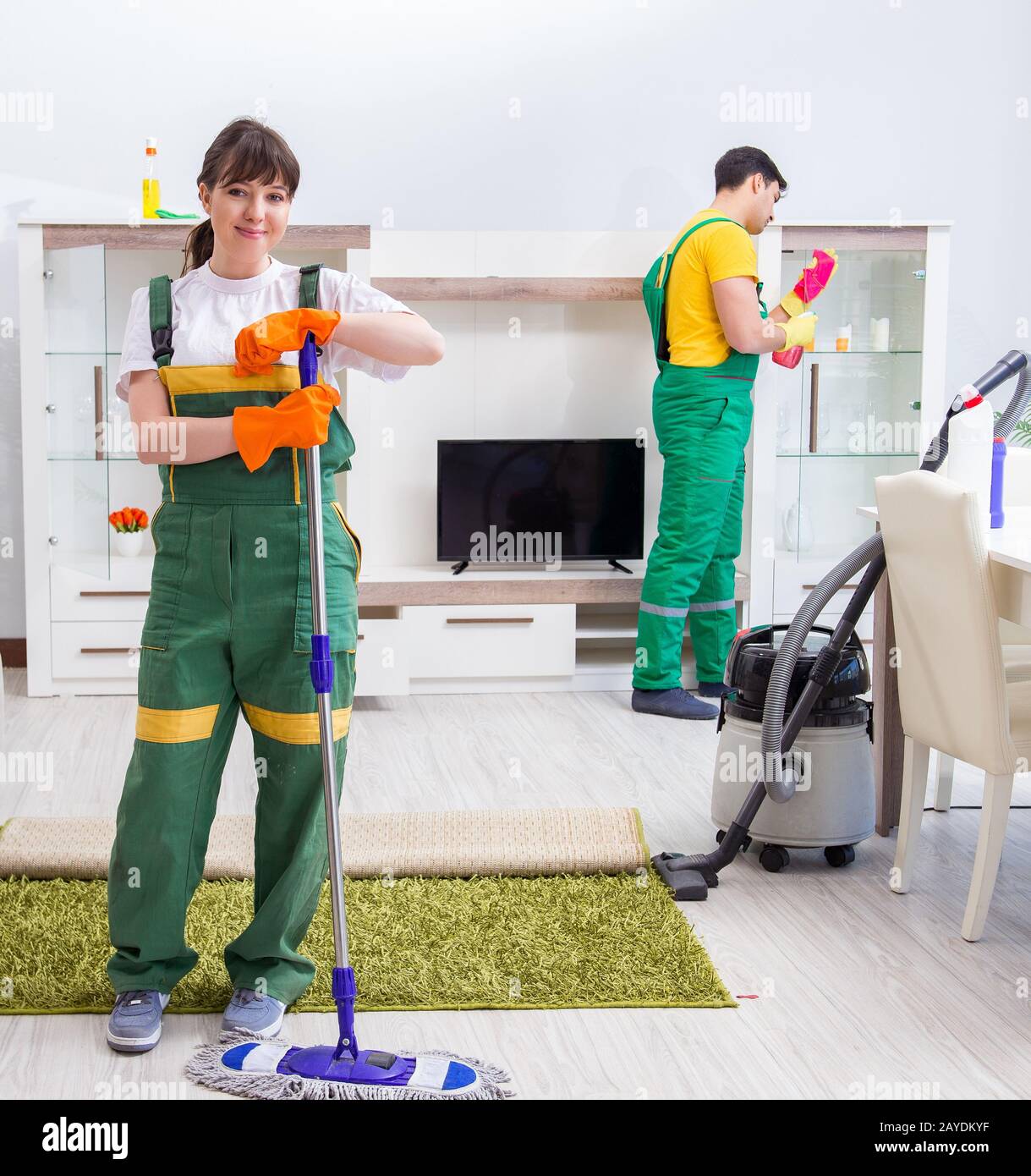 Cleaning professional contractors working at house Stock Photo - Alamy
