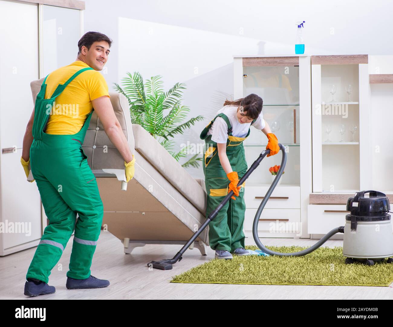 Cleaning professional contractors working at house Stock Photo - Alamy