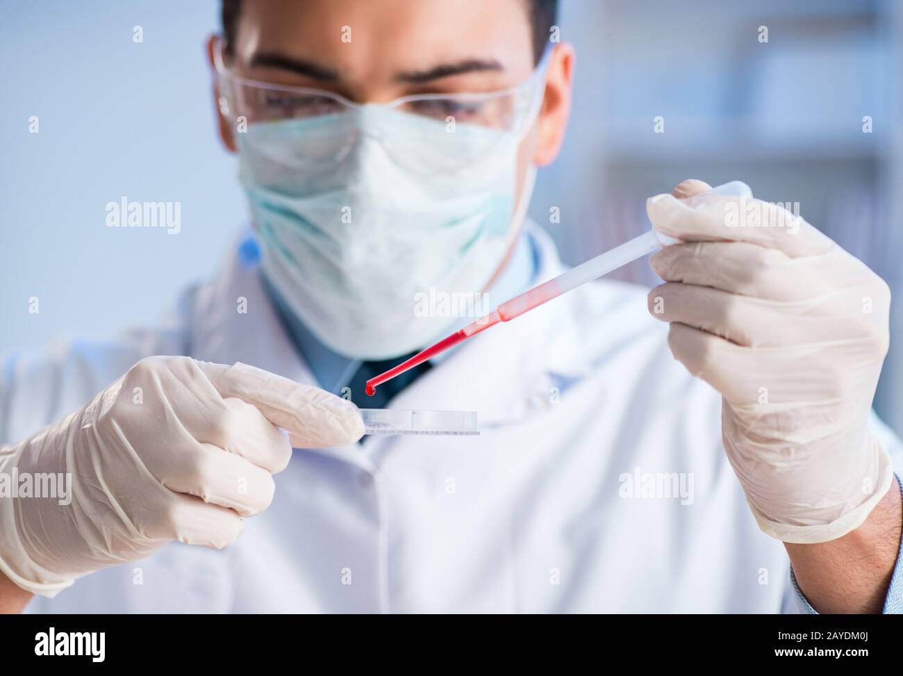 Lab assistant testing blood samples in hospital Stock Photo - Alamy