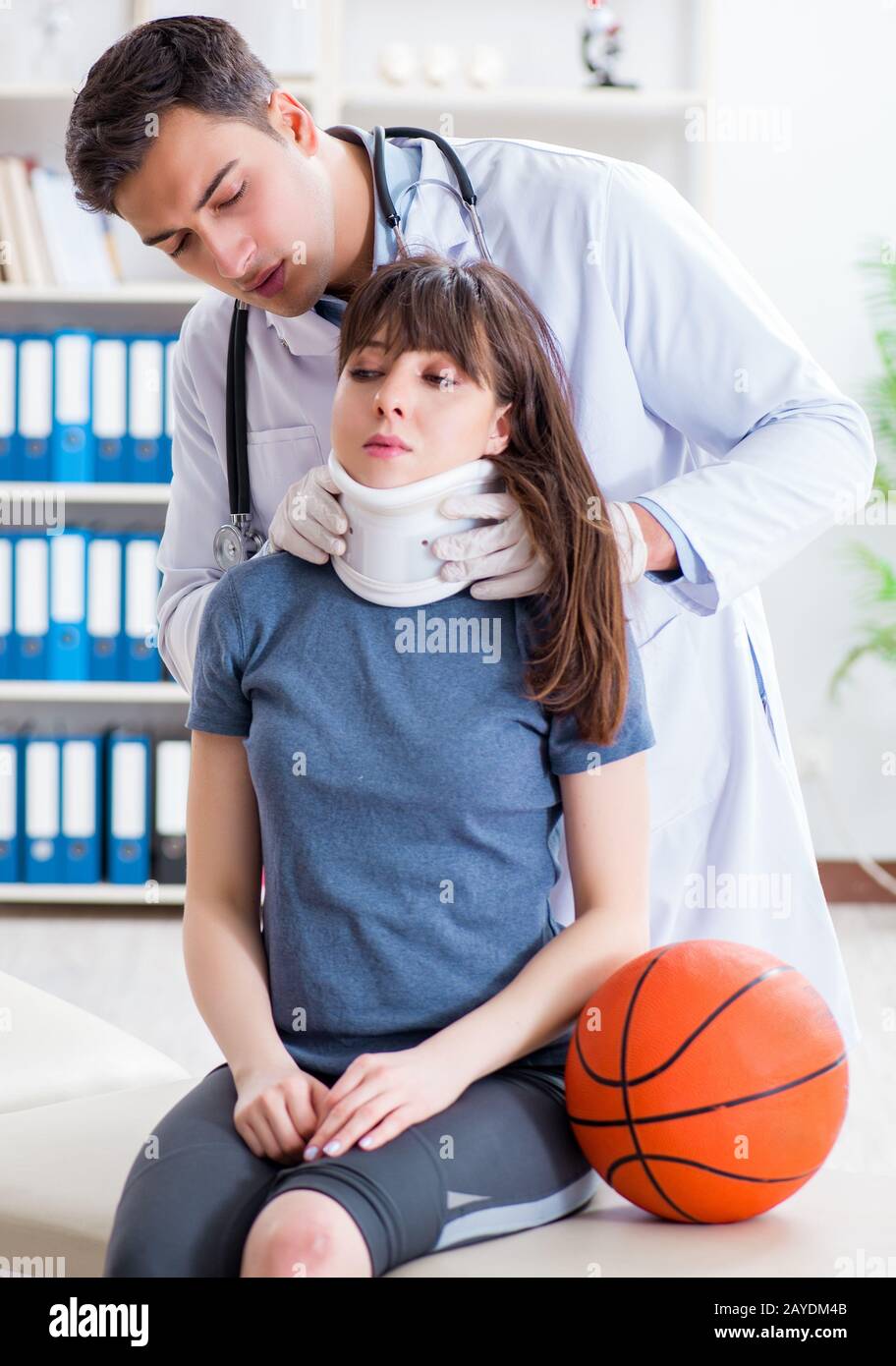 Female basketball player visiting doctor after injury Stock Photo - Alamy