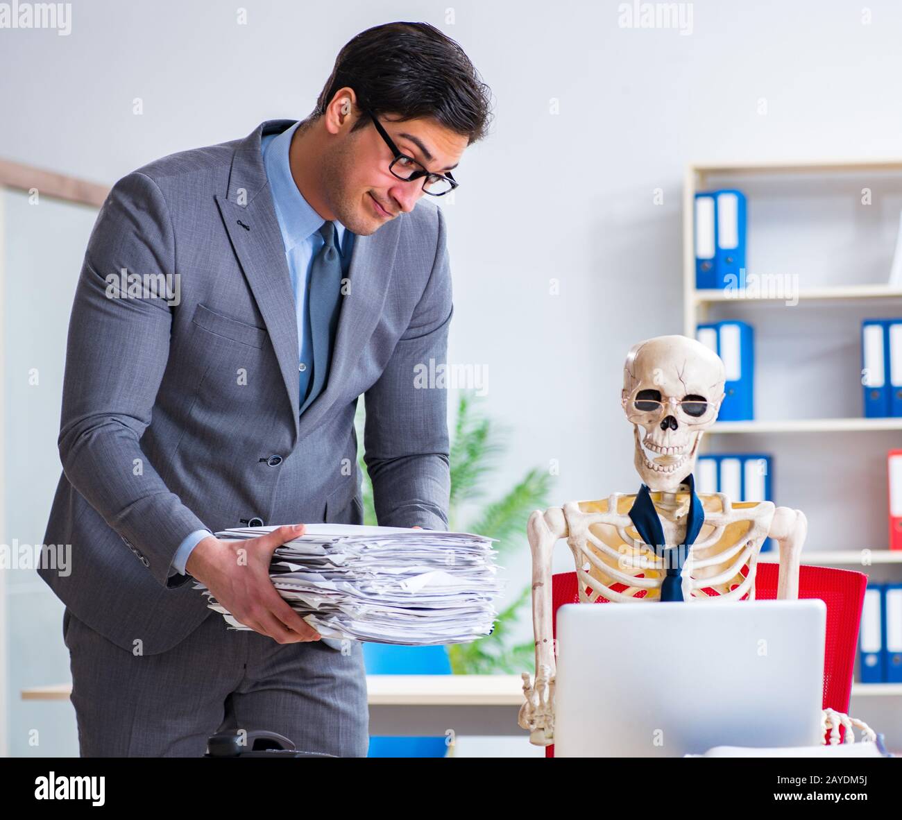 Angry boss yelling at his skeleton employee Stock Photo - Alamy