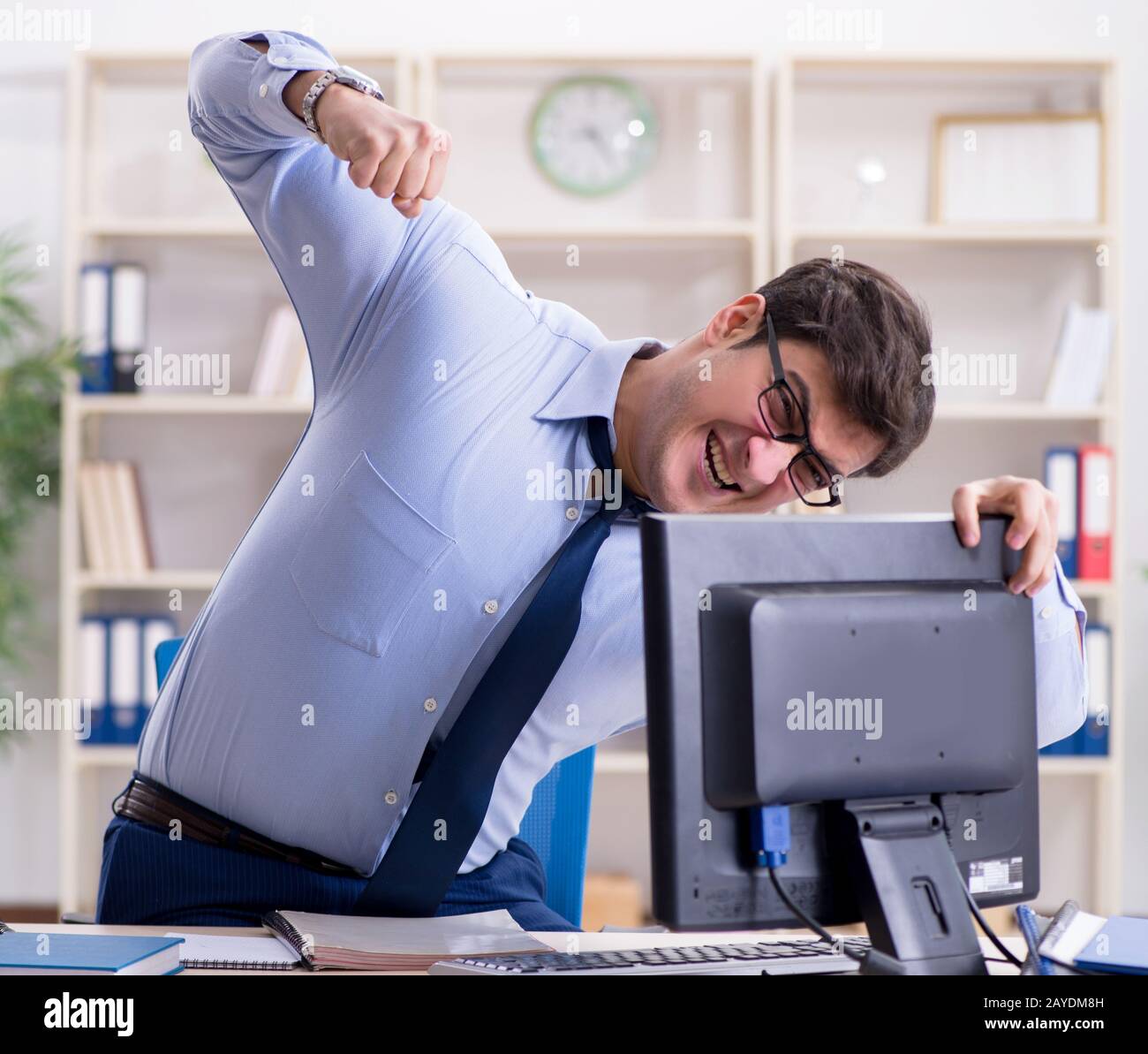 Angry businessman frustrated with too much work Stock Photo - Alamy