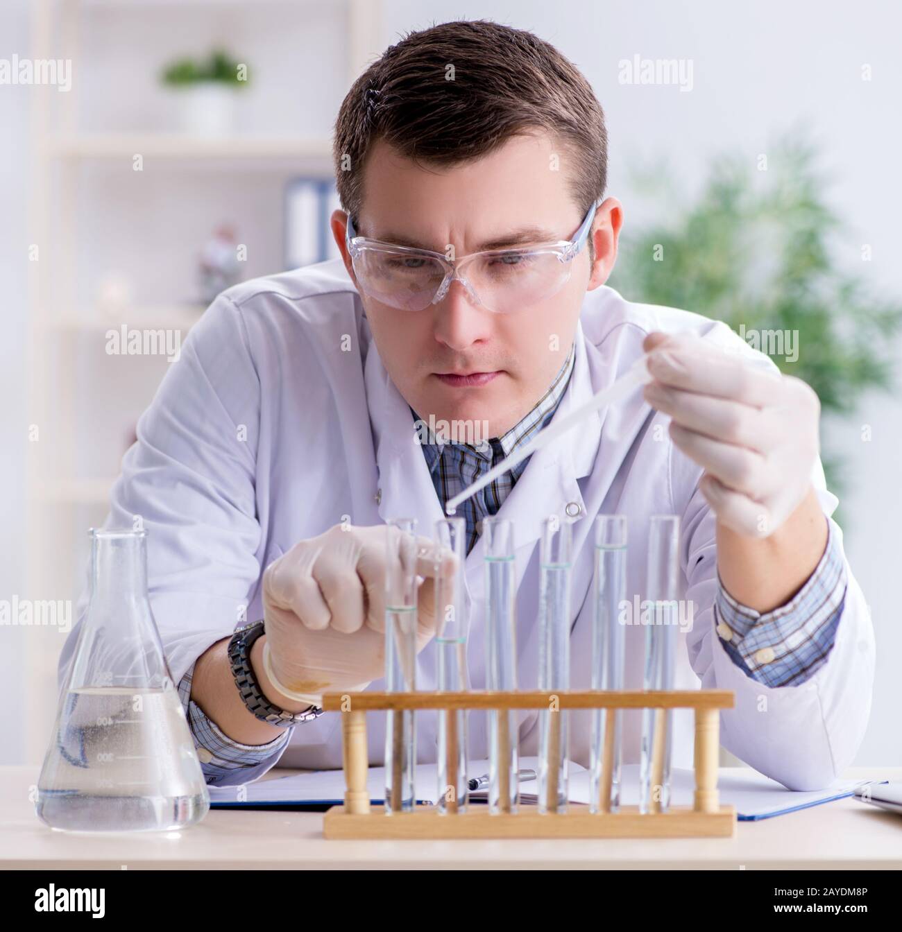 Scientist experimenting water sample hi-res stock photography and ...