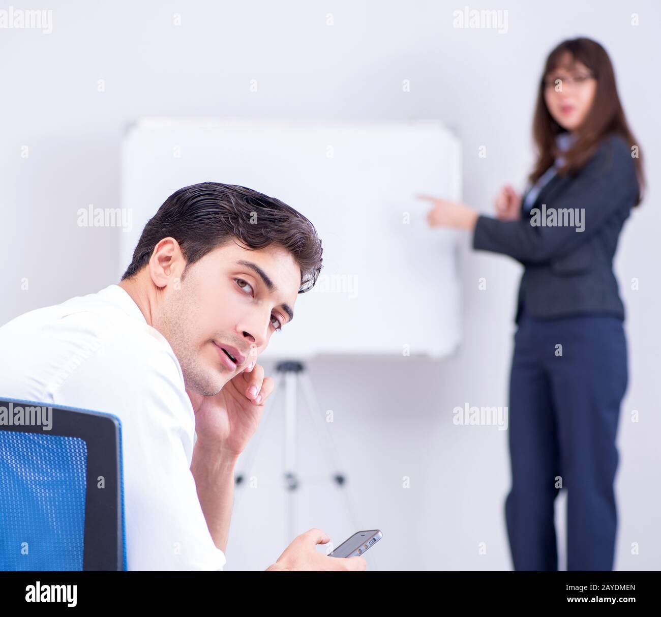 Business presentation in the office with man and woman Stock Photo - Alamy