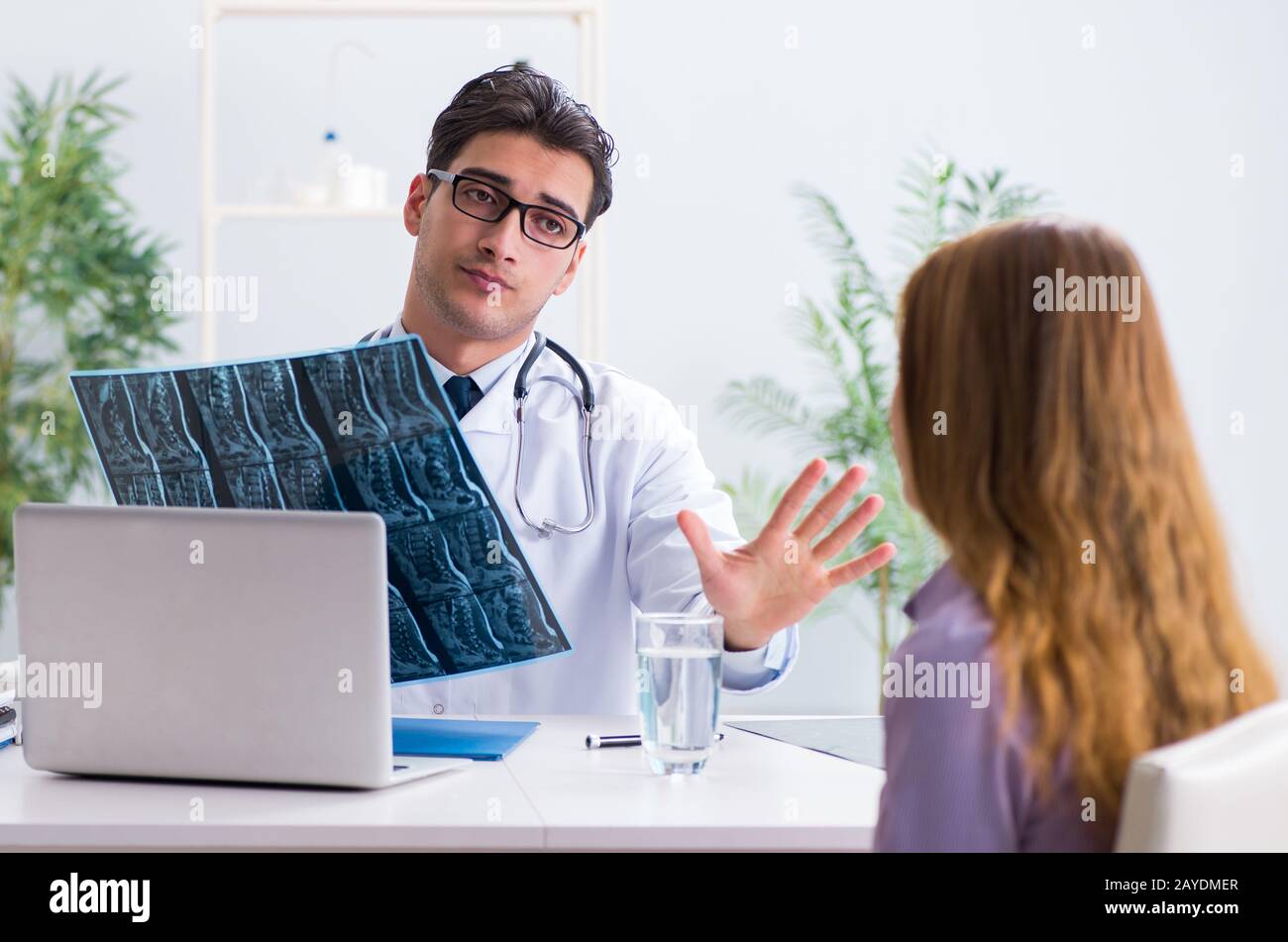 Doctor examining x-ray images of patient Stock Photo - Alamy
