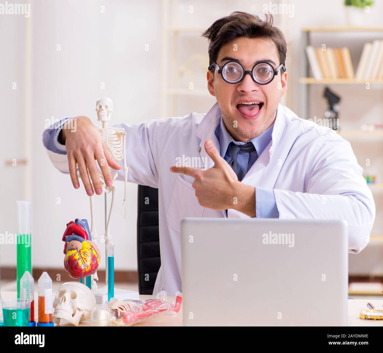 Funny doctor having fun in hospital lab Stock Photo - Alamy