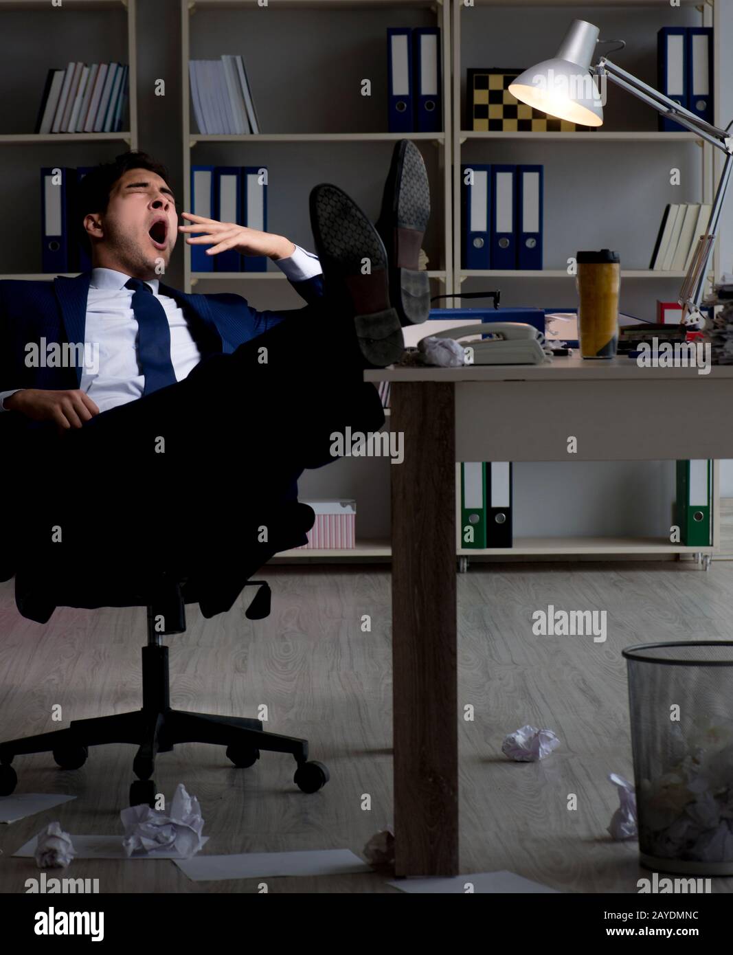 The employee working late to finish important deliverable task Stock ...