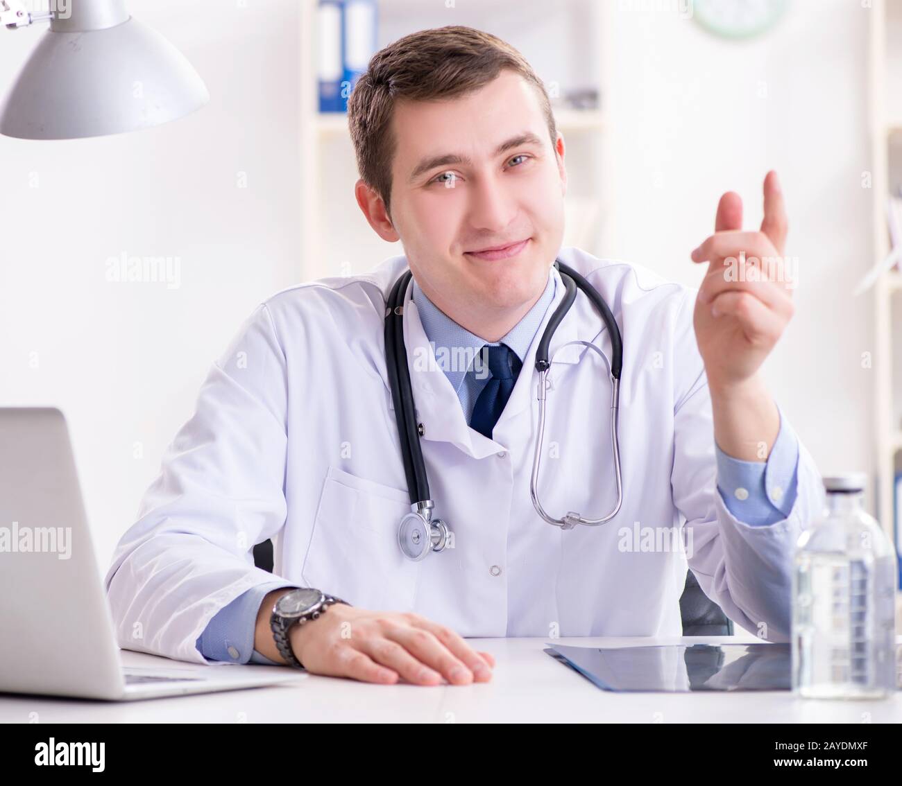 Male doctor looking at lab results in hospital Stock Photo - Alamy