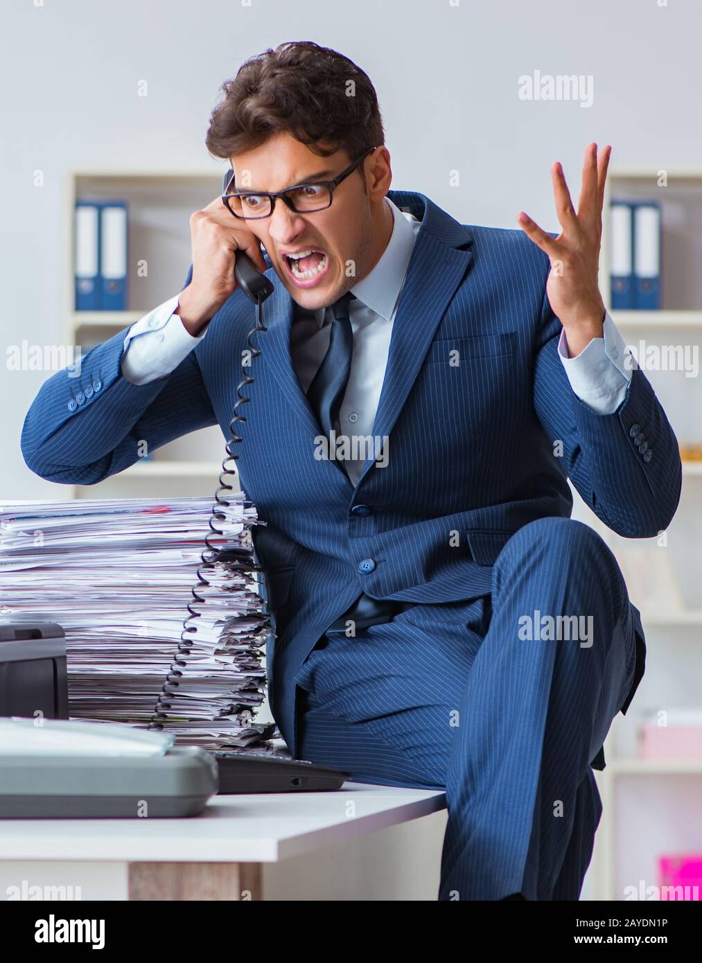 Businessman making copies in copying machine Stock Photo - Alamy