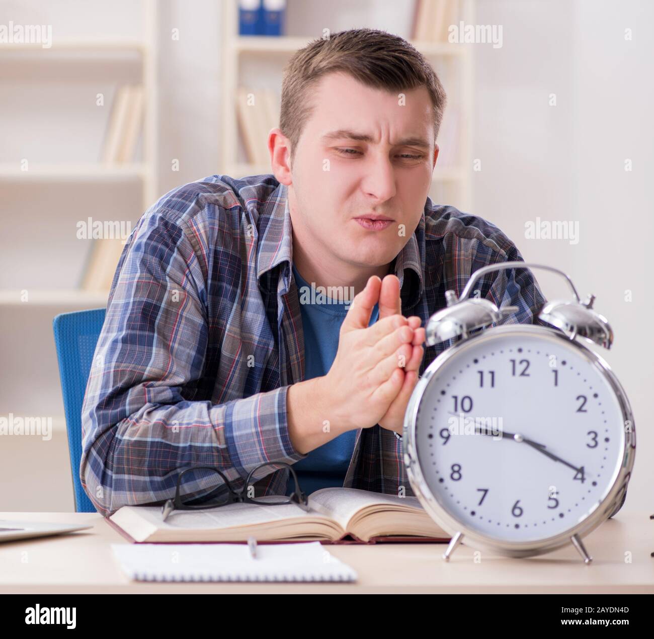 Student getting late with exam preparation Stock Photo - Alamy