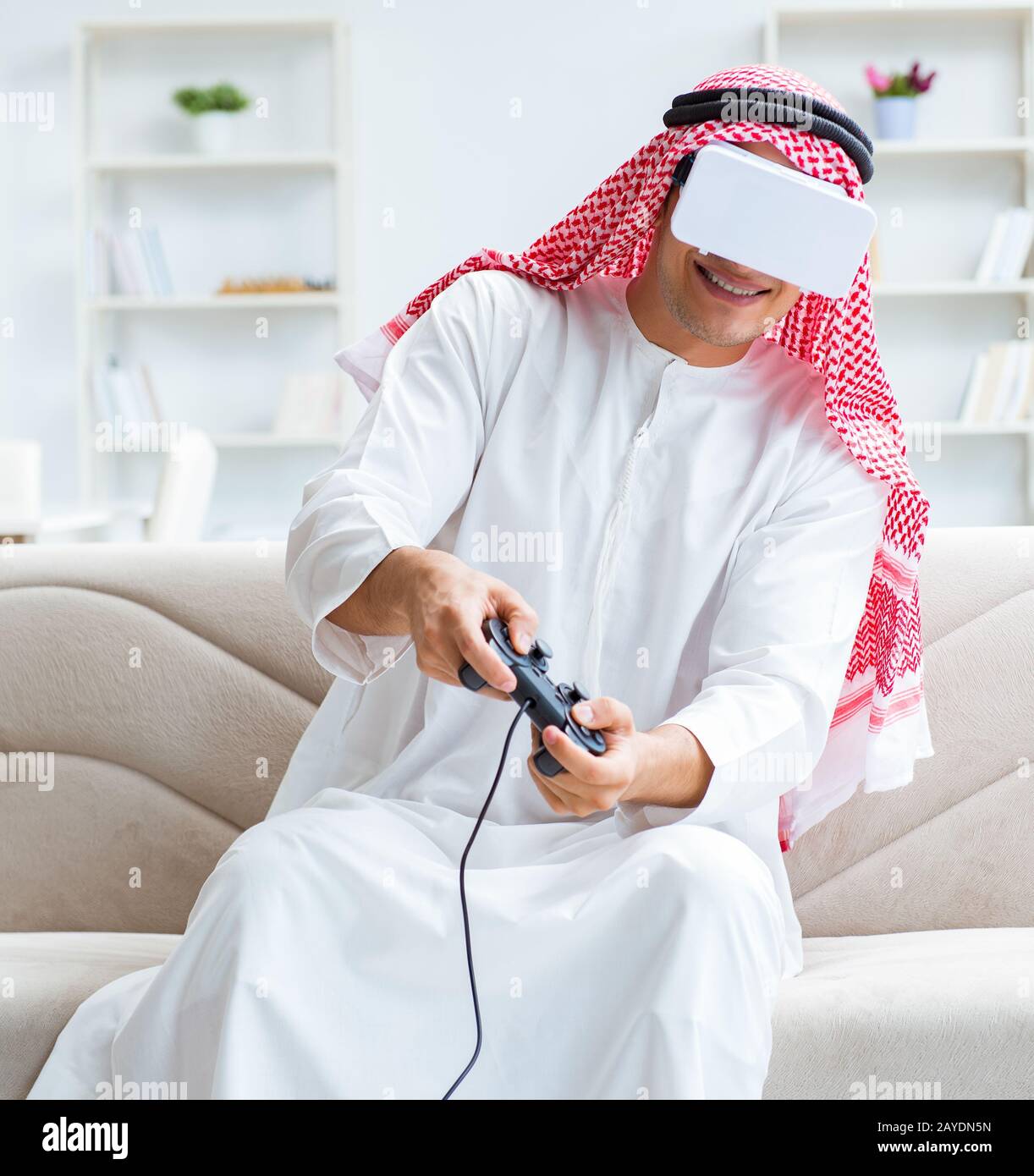 Arab man addicted to video games Stock Photo - Alamy