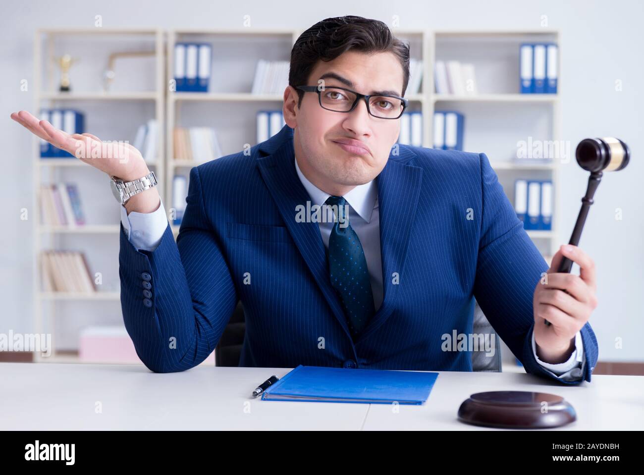 Young lawyer judge sitting in the office Stock Photo - Alamy