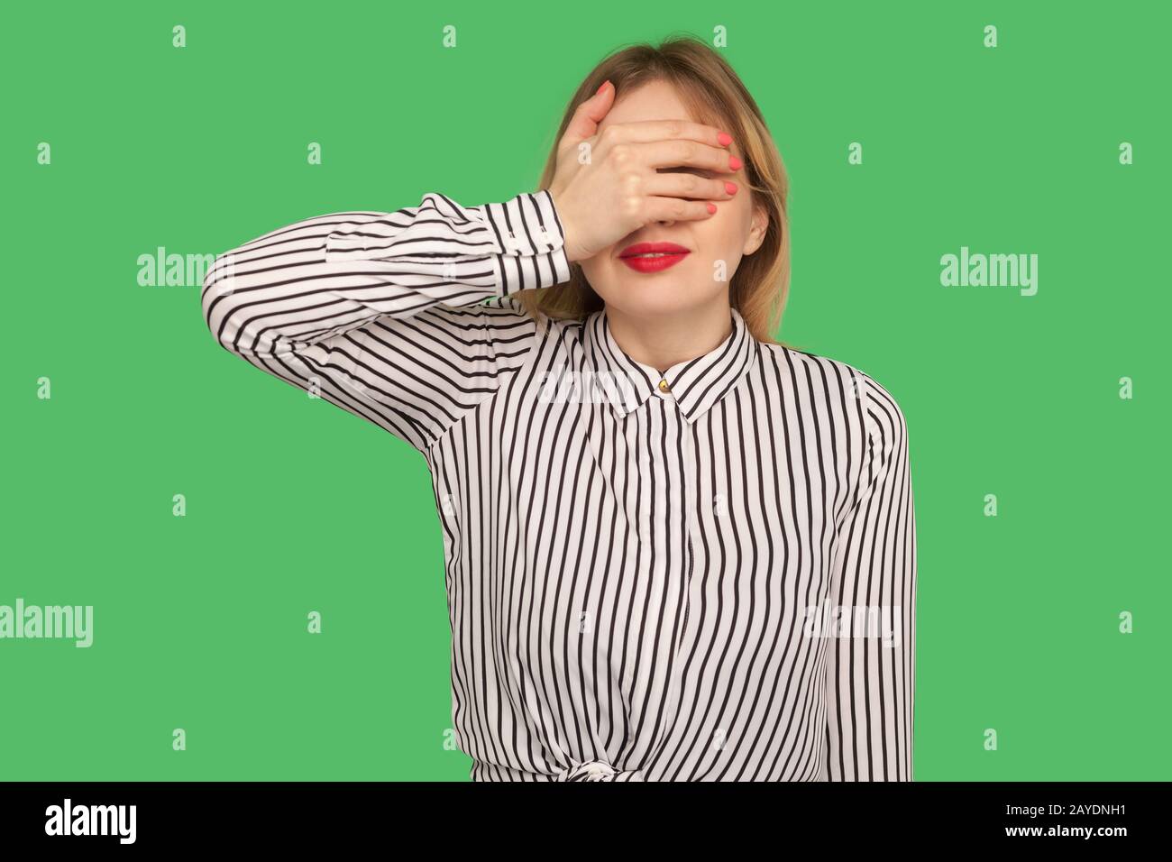 Don't want to look at this! Portrait of shy confused girl with red lips ...