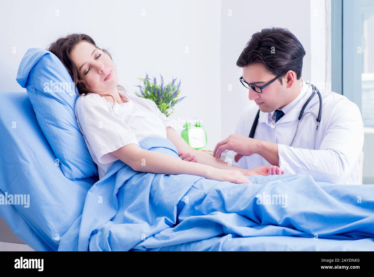 Doctor doing medical injection in hospital room Stock Photo - Alamy