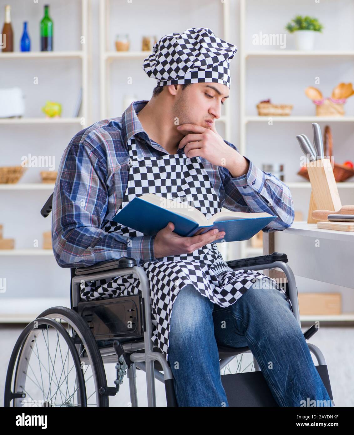 Young man cook book hi-res stock photography and images - Alamy