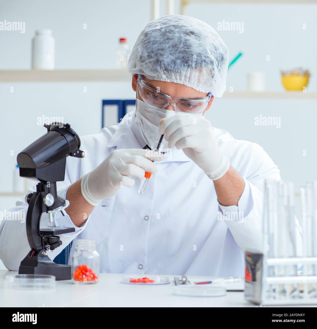 Doctor testing new drugs for medical purposes Stock Photo - Alamy