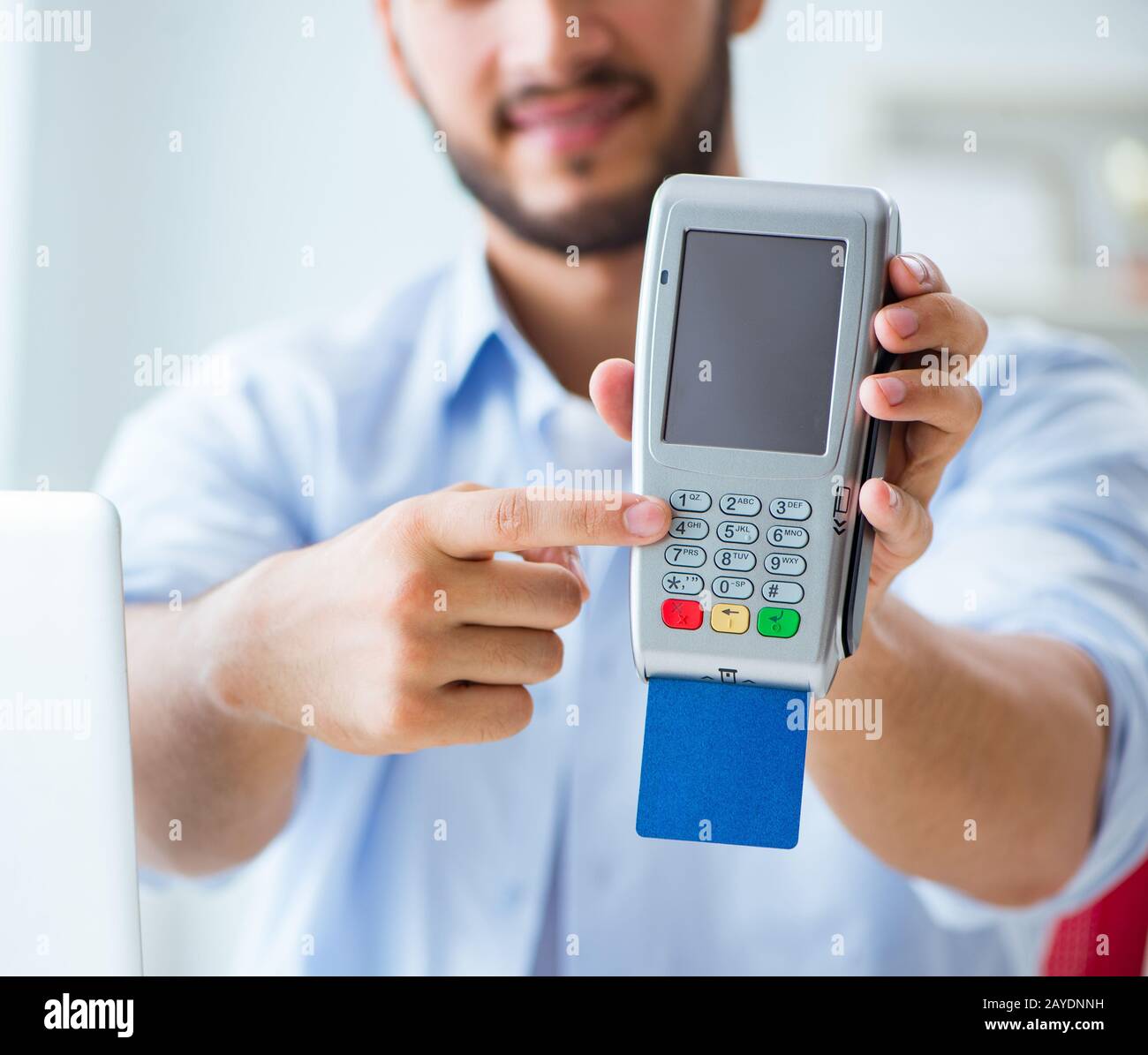Man processing credit card transaction with POS terminal Stock Photo ...