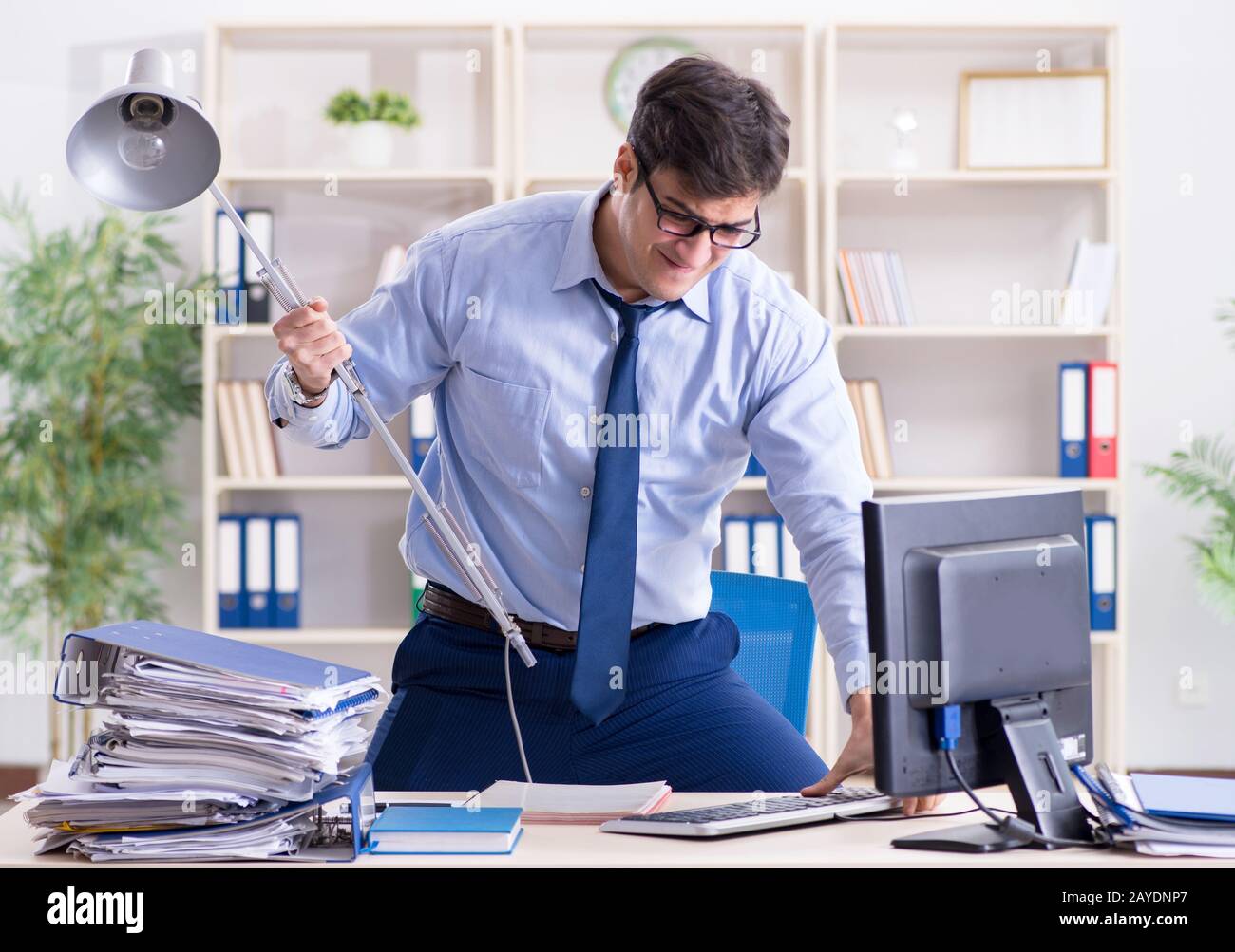 Angry businessman frustrated with too much work Stock Photo - Alamy