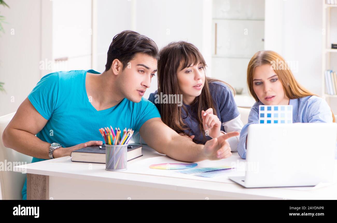 Team of designers discussing new interior project Stock Photo - Alamy