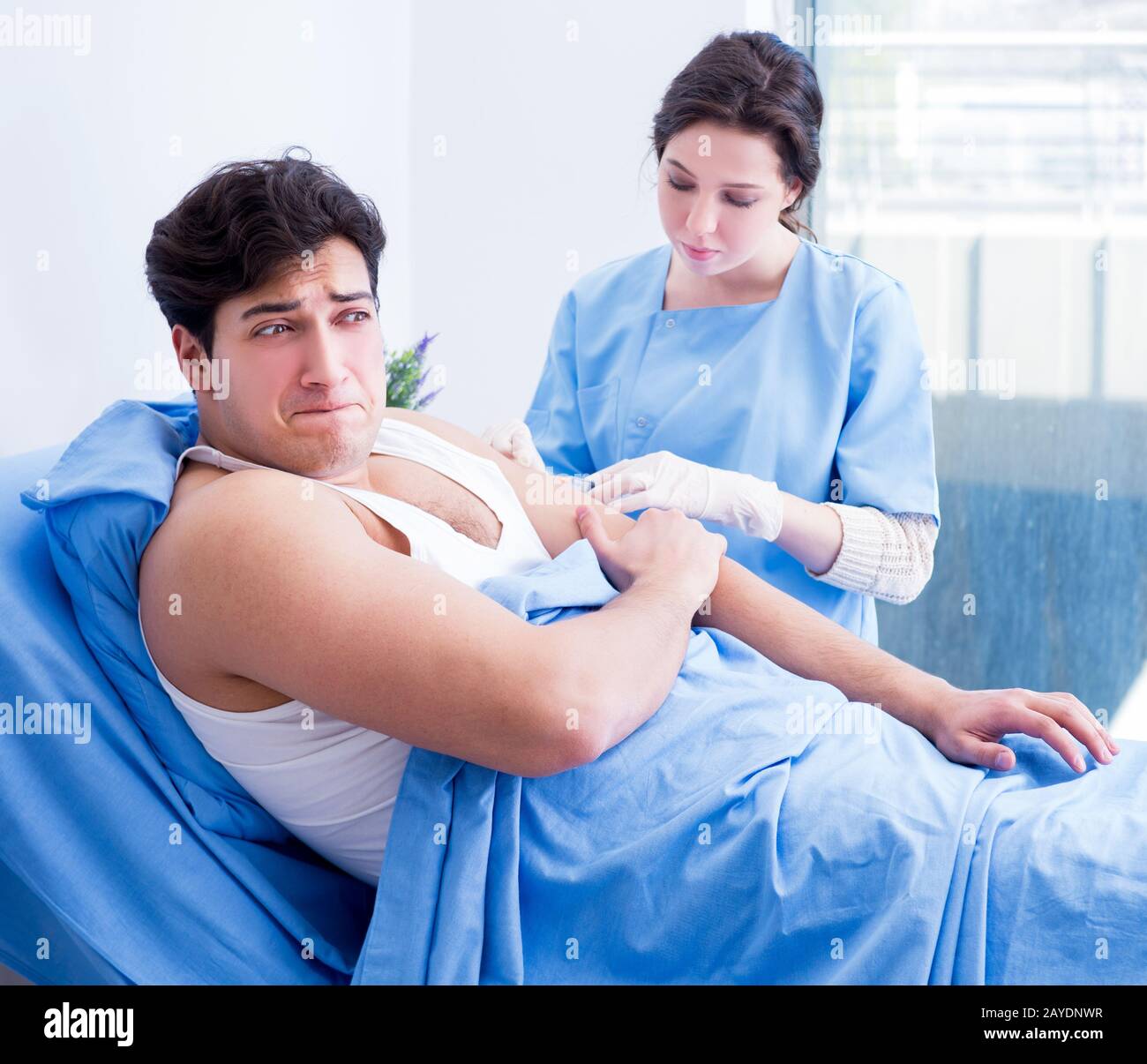 Doctor doing medical injection in hospital room Stock Photo - Alamy