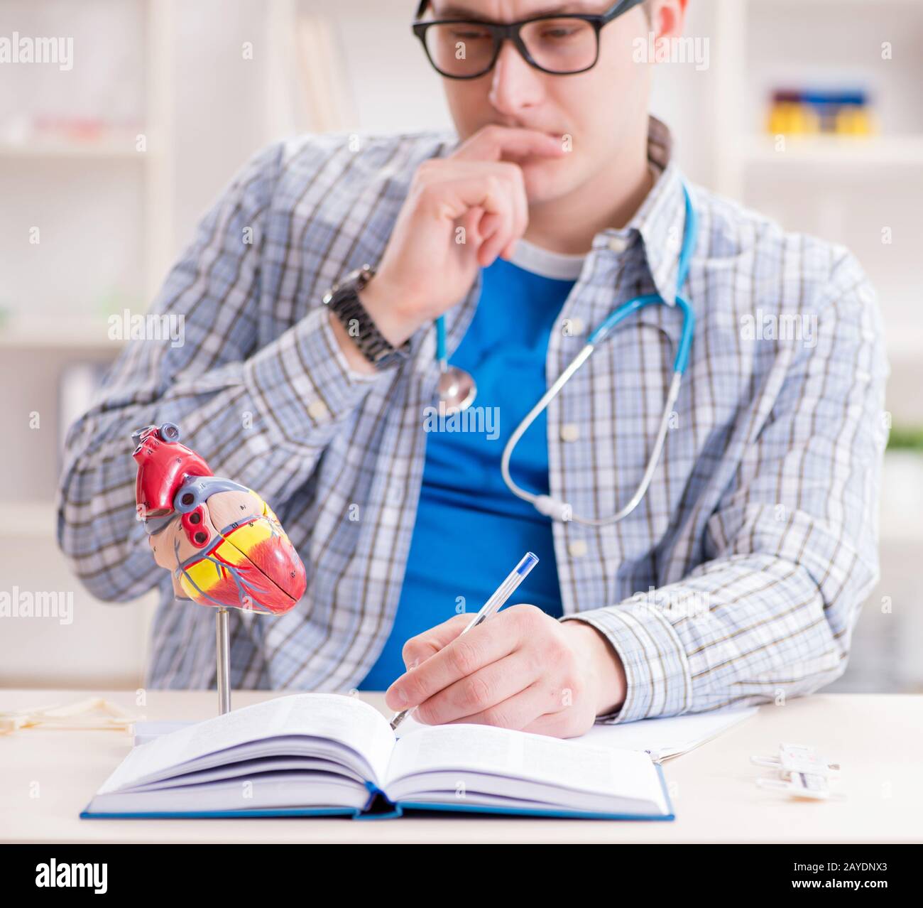 Medical student studying heart in classroom during lecture Stock Photo ...
