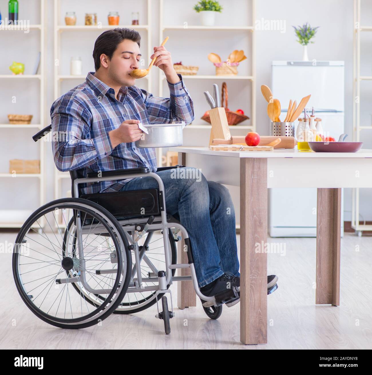 Disabled man cooking hi-res stock photography and images - Alamy