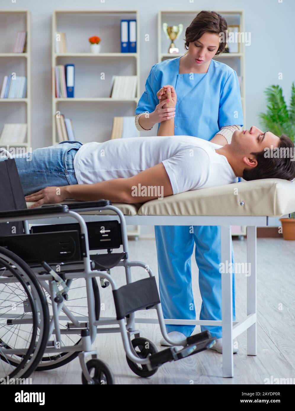 Patient undergoing rehabilitation recovery programme with doctor Stock ...