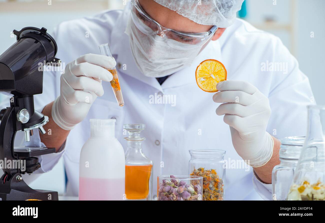 Chemist mixing perfumes in the lab Stock Photo - Alamy