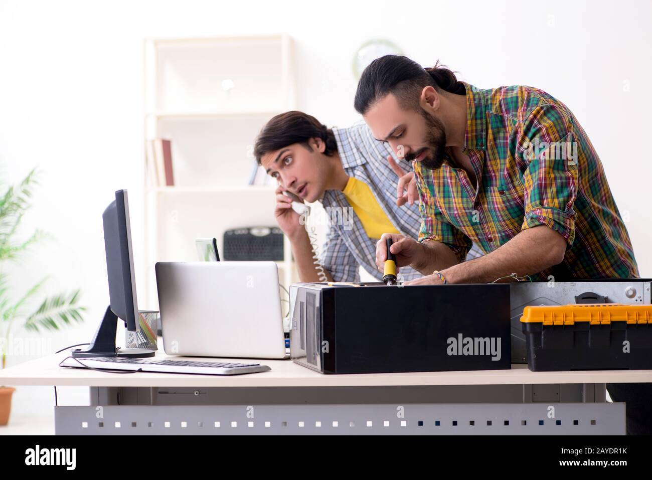 Two engineers working on computer hi-res stock photography and images ...