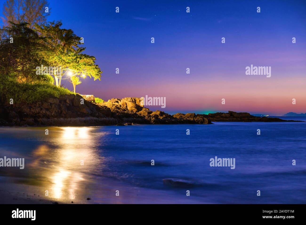 Night view of sand beach at tropical island Stock Photo - Alamy