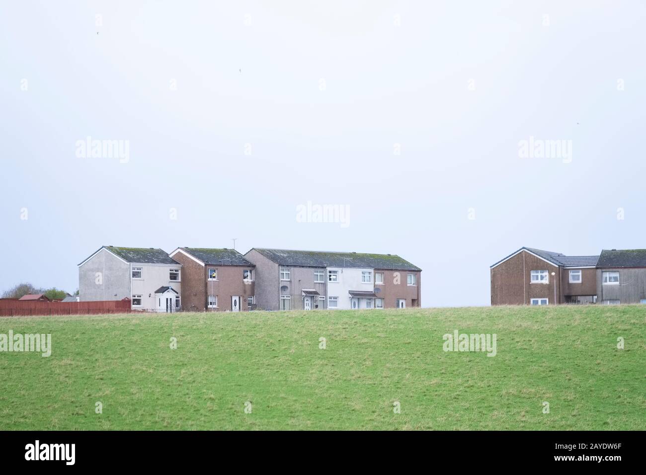 Poor council houses on cliff horizon in seaside town by coast Stock ...