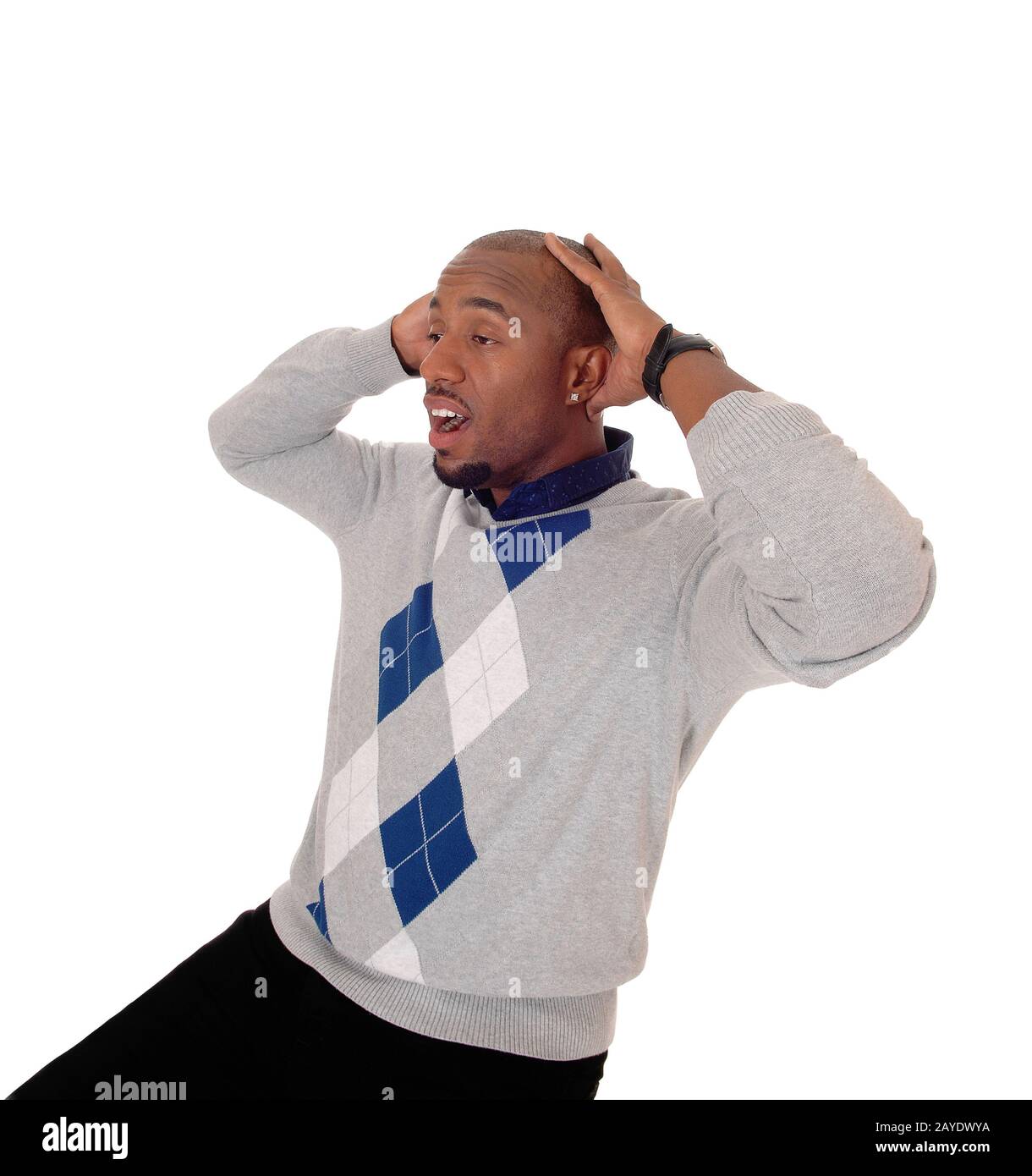 An African man sitting and screaming Stock Photo - Alamy