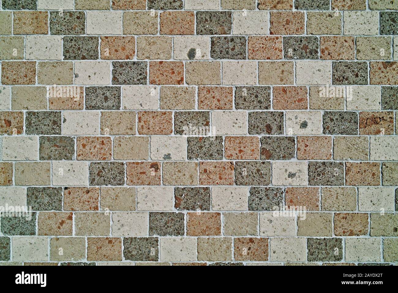 wall made with blocks of different varieties of tuff Stock Photo - Alamy