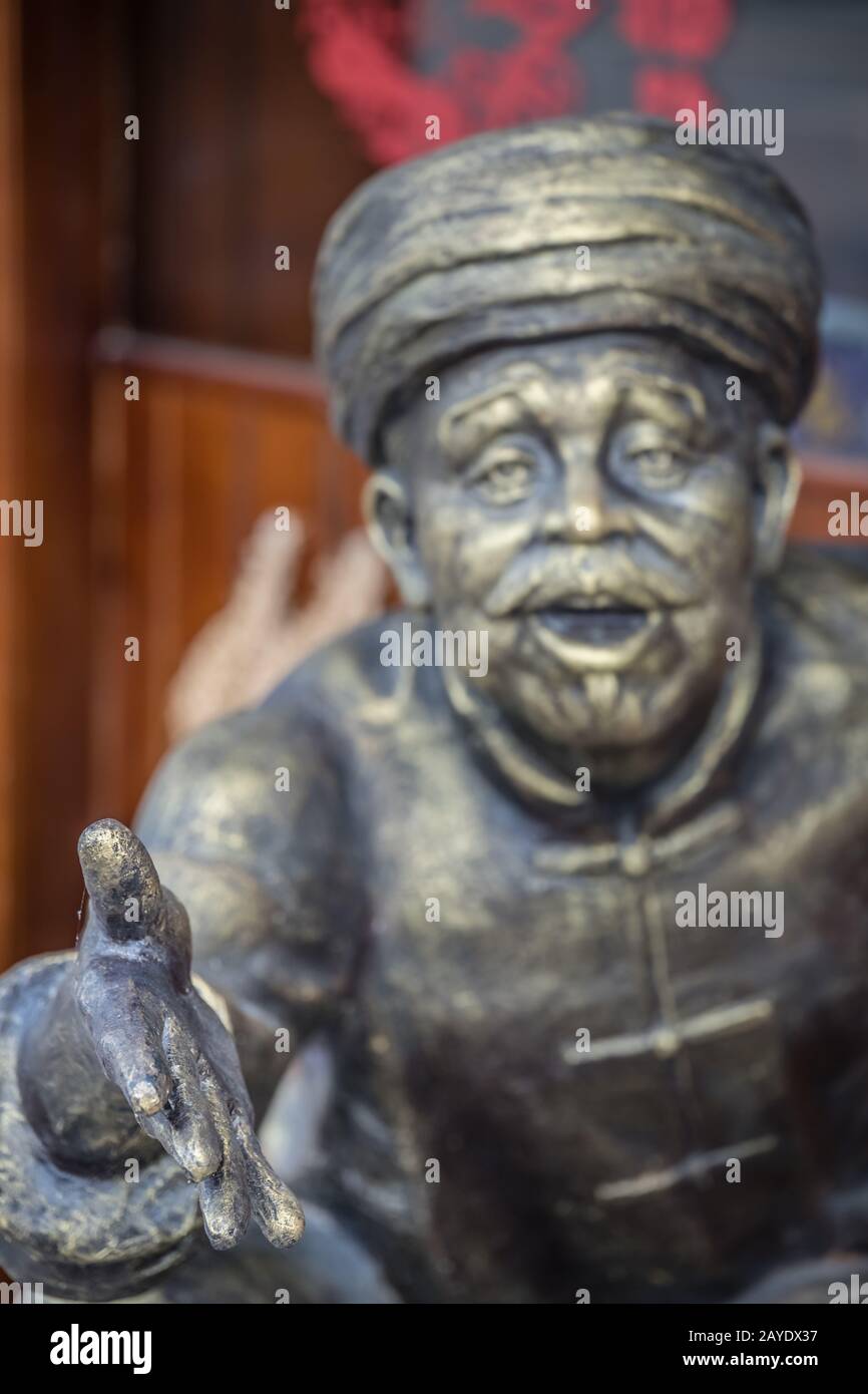 Brass sculpture of a Chinese man Stock Photo - Alamy