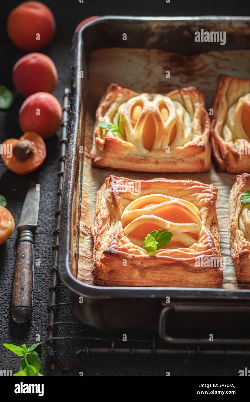 Awesome puff pastry made of fresh peaches and sugar Stock Photo - Alamy