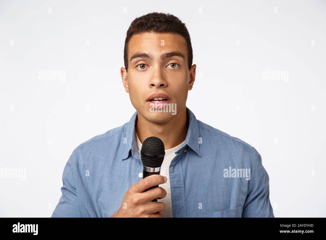 Cute romantic young caucasian guy confess love in front audience ...